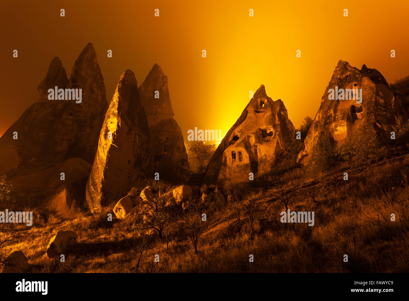 Cave homes in rock formations and fairy chimneys; Goreme, Cappadocia ...