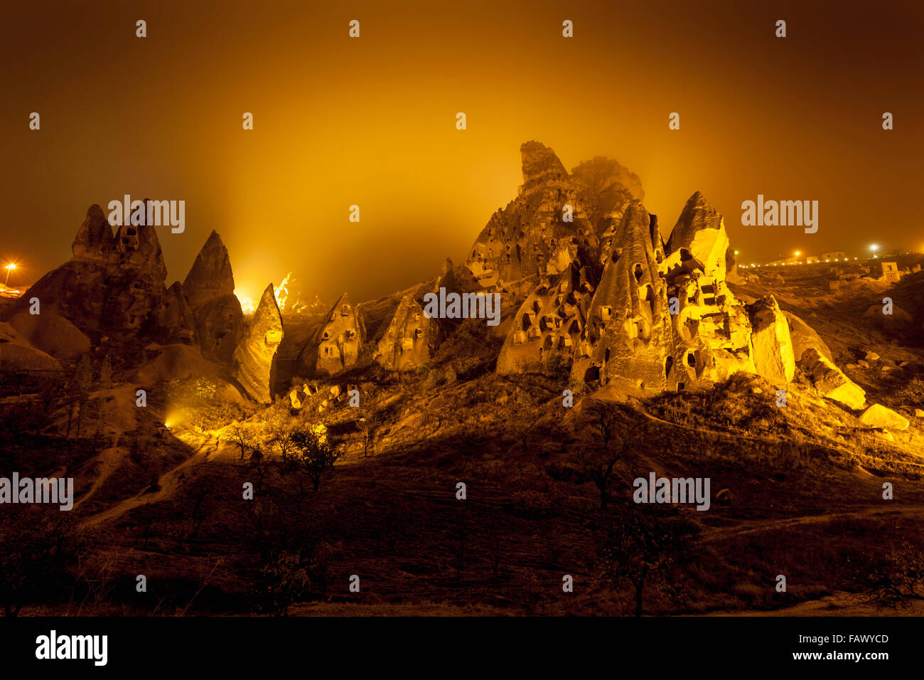 Cave homes in rock formations and fairy chimneys; Goreme, Cappadocia ...