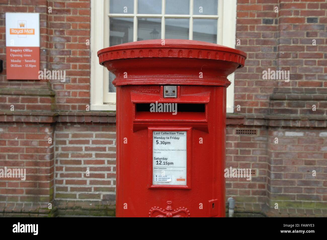 A red old fashioned letter box with a brick wall background Stock Photo ...