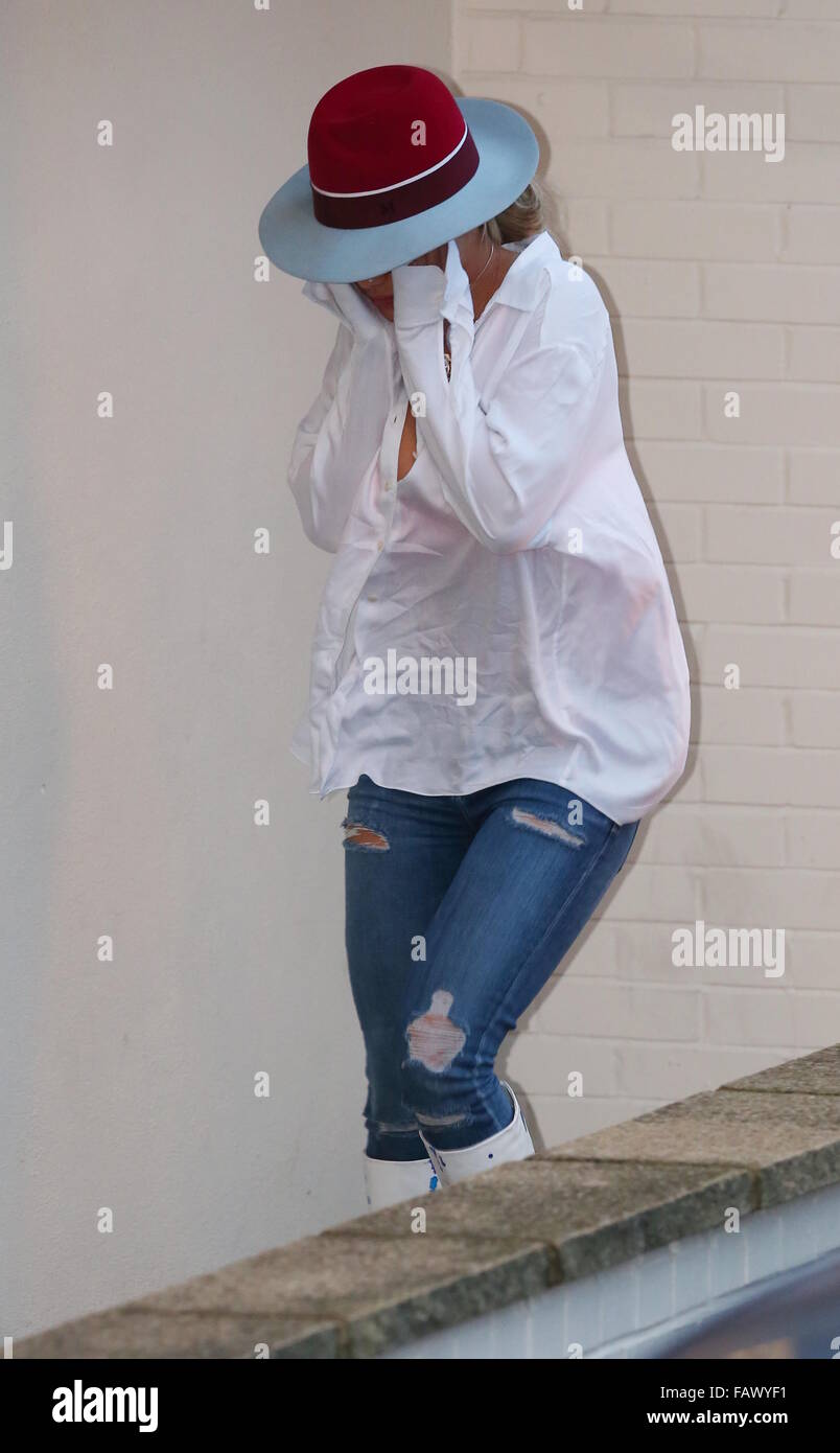 'X Factor' judges Rita Ora covers her face as she arrives at rehearsals ...