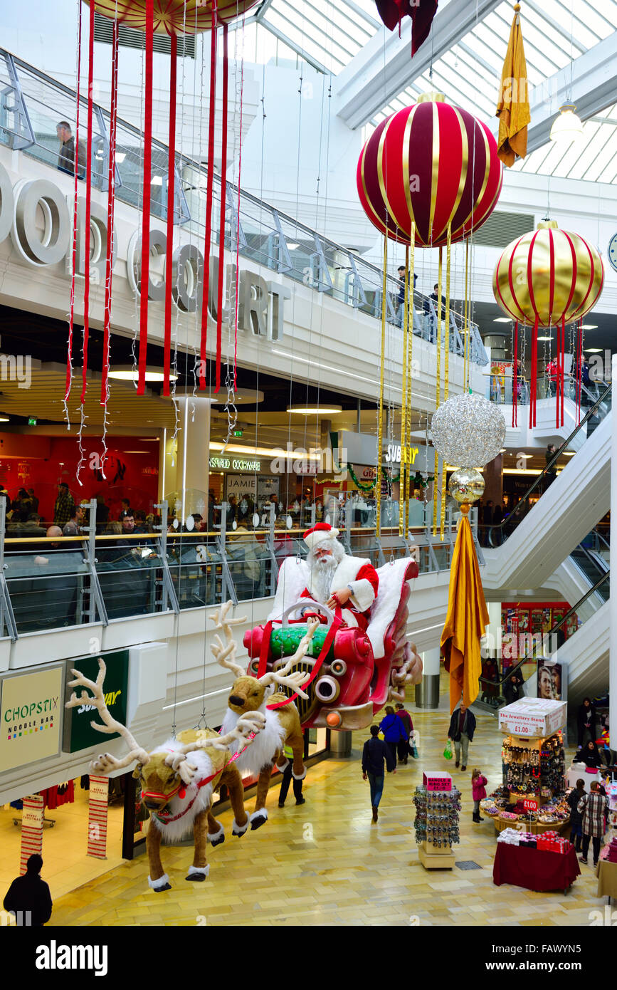 Santa Claus in slay with reindeer above Christmas shoppers in The ...