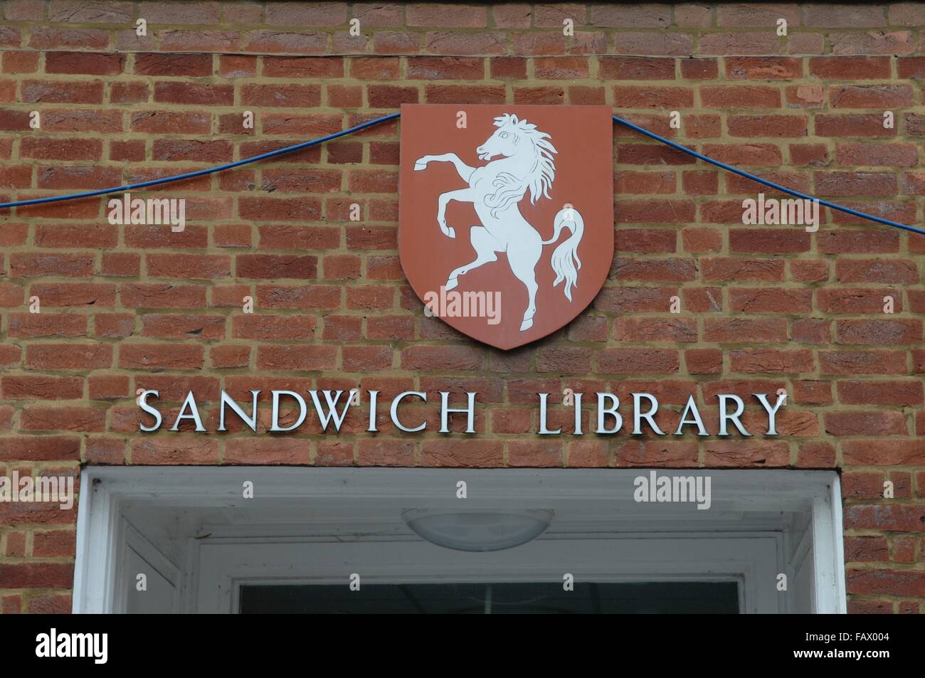 A image of the Sandwich Library's logo with a brick wall behind Stock ...