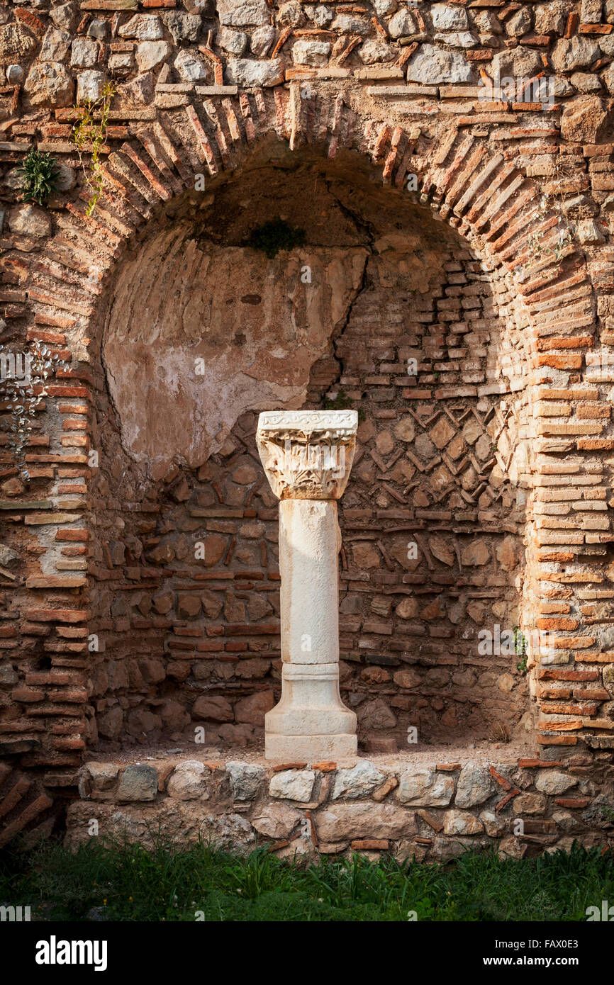 Niche in a stone wall with column and capitol; Delphi, Greece Stock ...