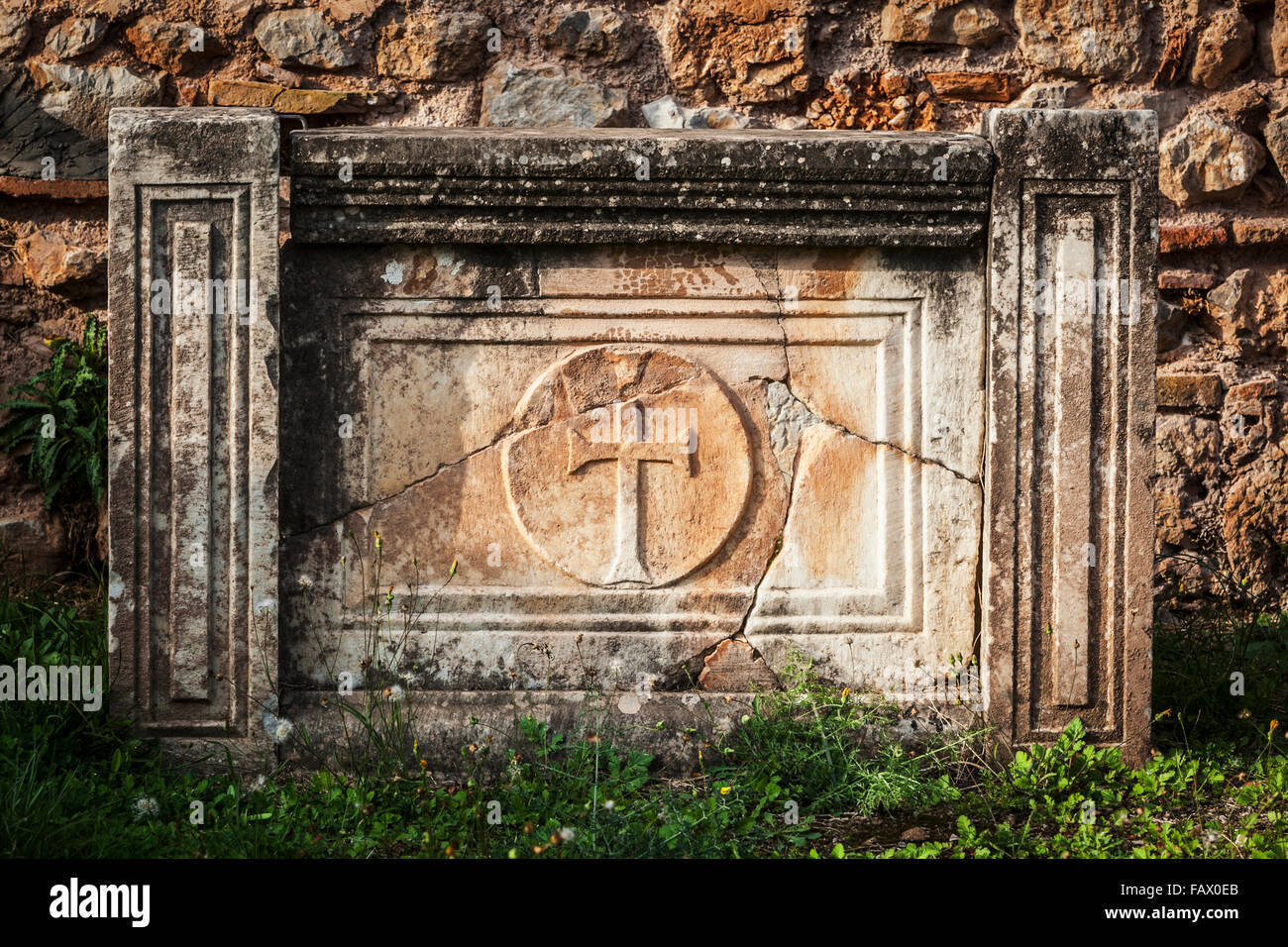 Cracked stone structure with a cross; Delphi, Greece Stock Photo - Alamy