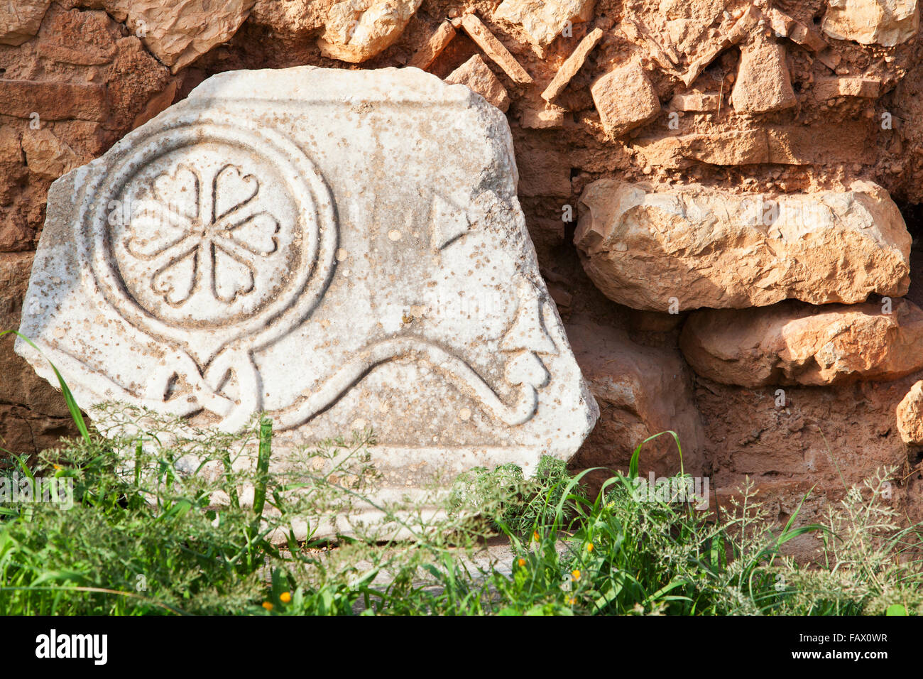 Broken stone structure with a floral design; Delphi, Greece Stock Photo ...
