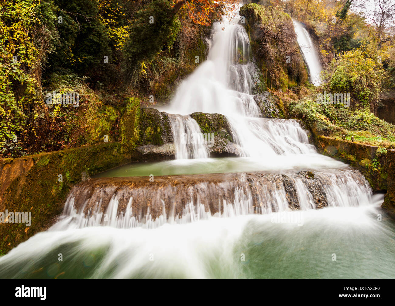 Waterfalls from the Edessaios river with autumn coloured foliage ...