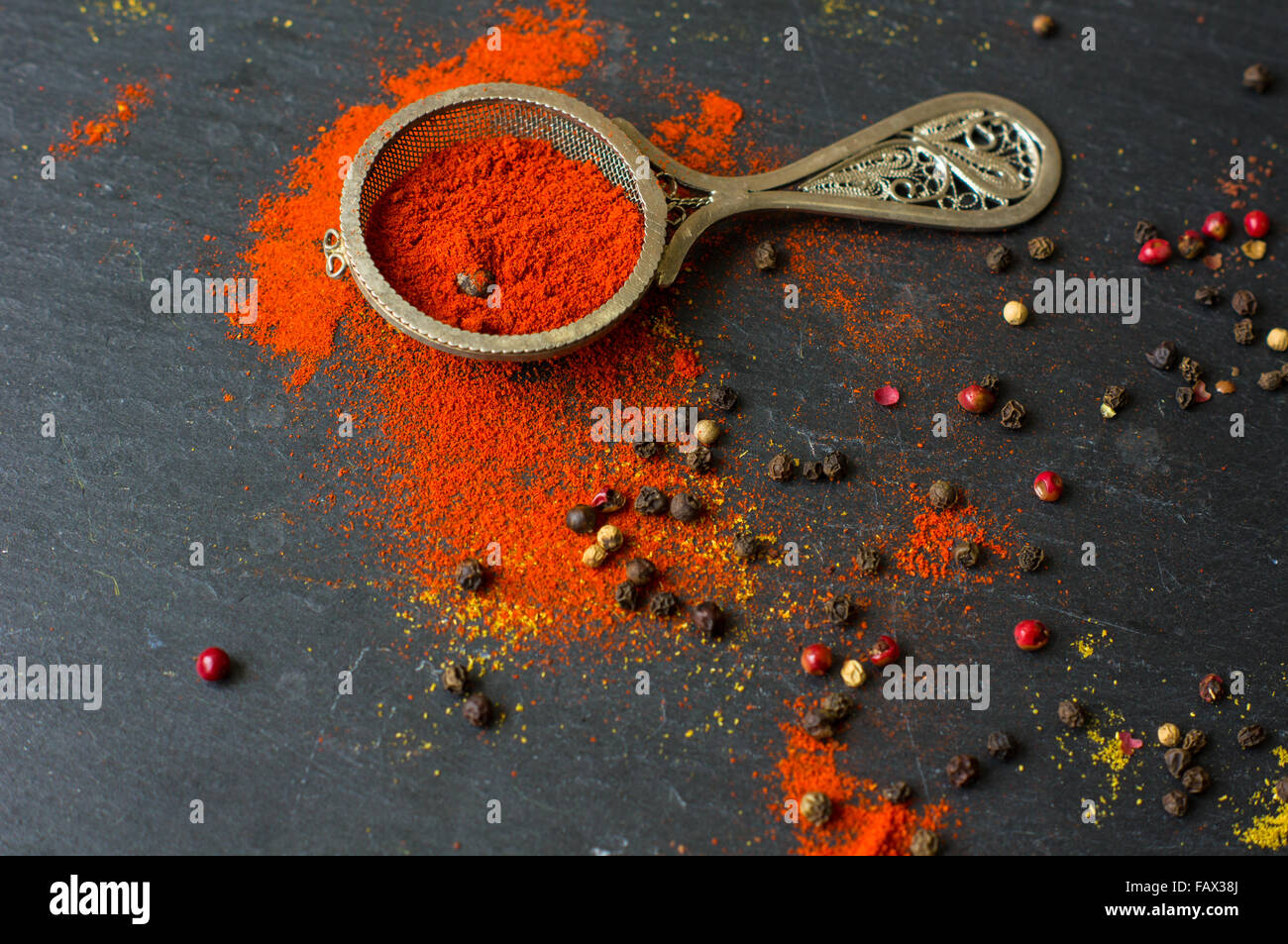 Paprika pepper spices and wintage silverware on rustic background Stock ...