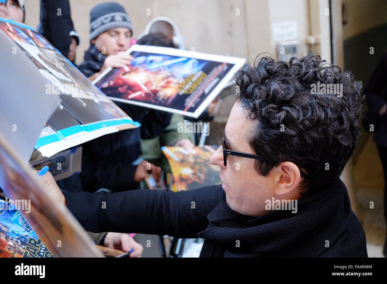 Star Wars director JJ Abrams signs posters for fans outside of ...