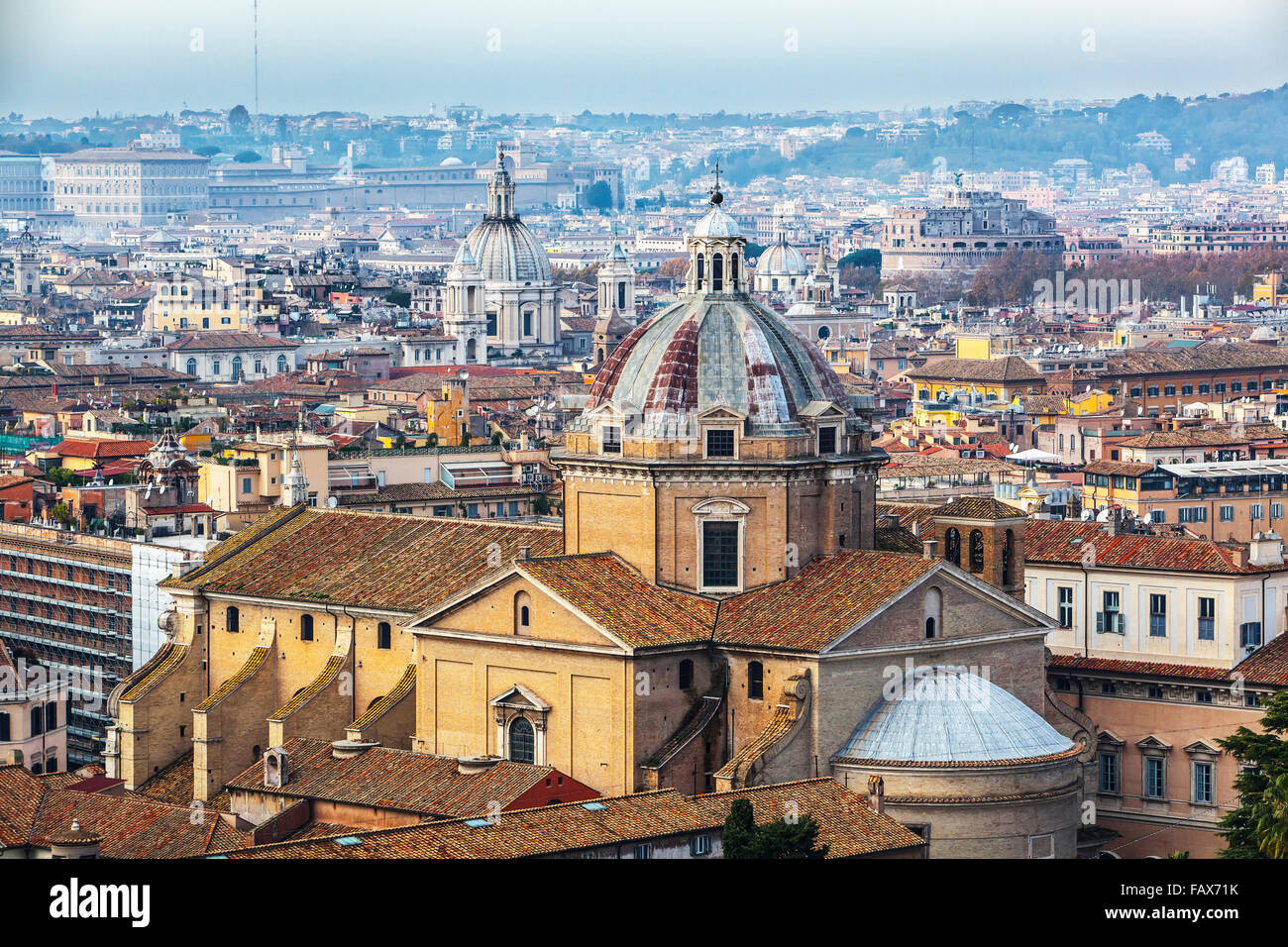 Dome of church roof with cross and various other buildings; Rome, Italy ...