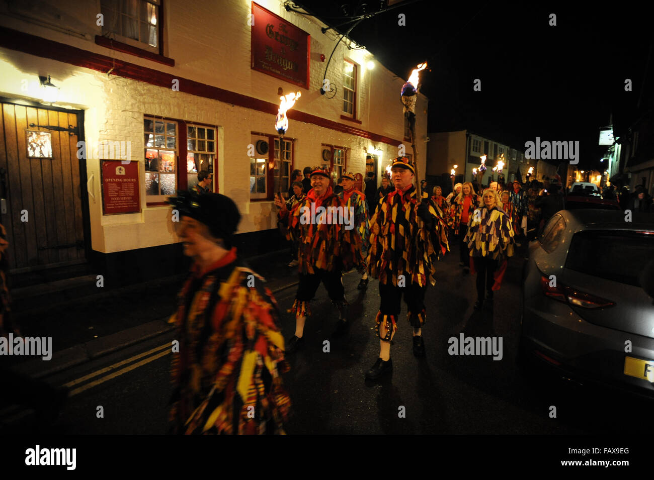 Members of the Sompting Village Morris carry flaming torches through ...