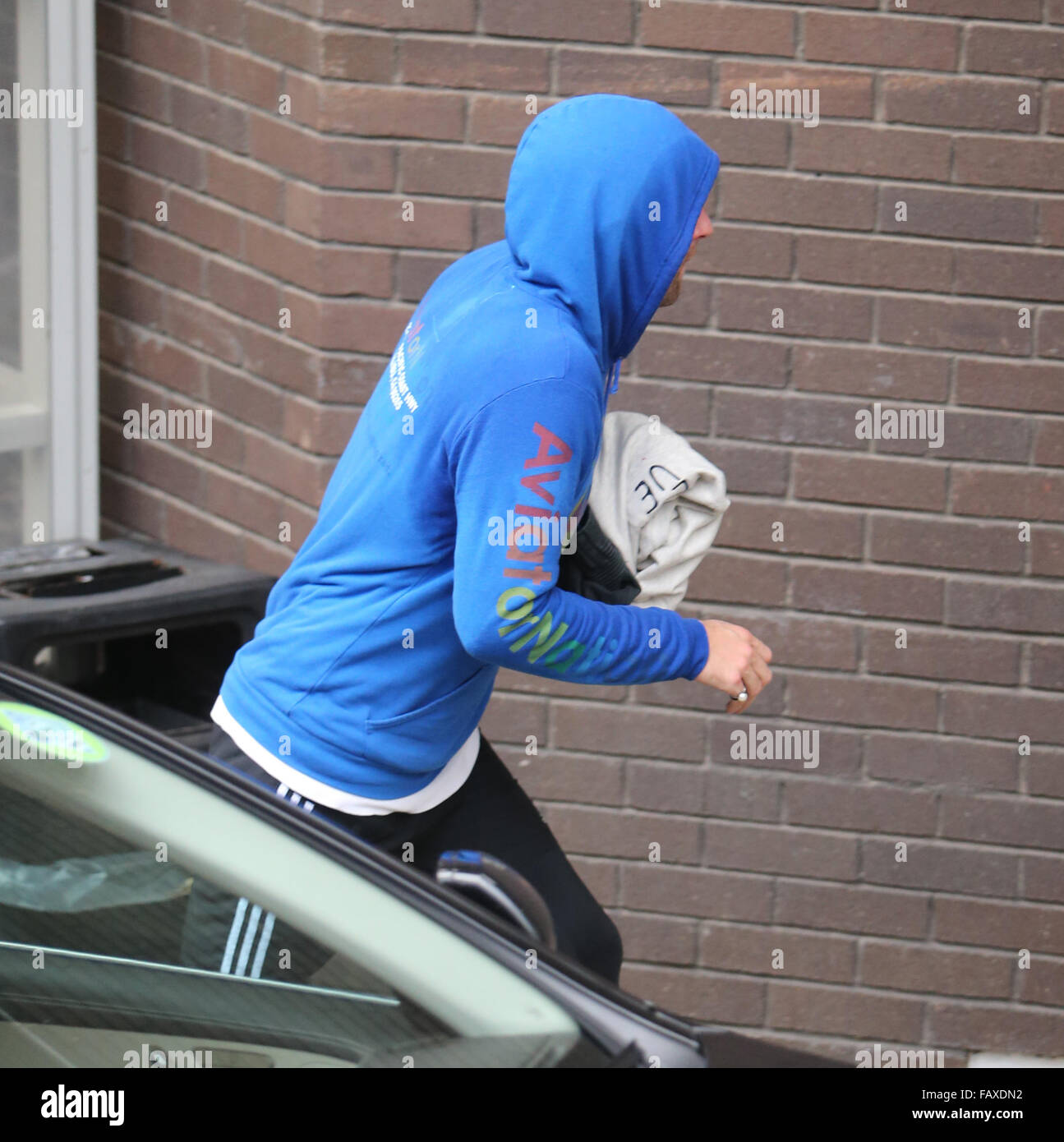 Chris Martin outside ITV Studios wearing a blue hooded top, covering ...