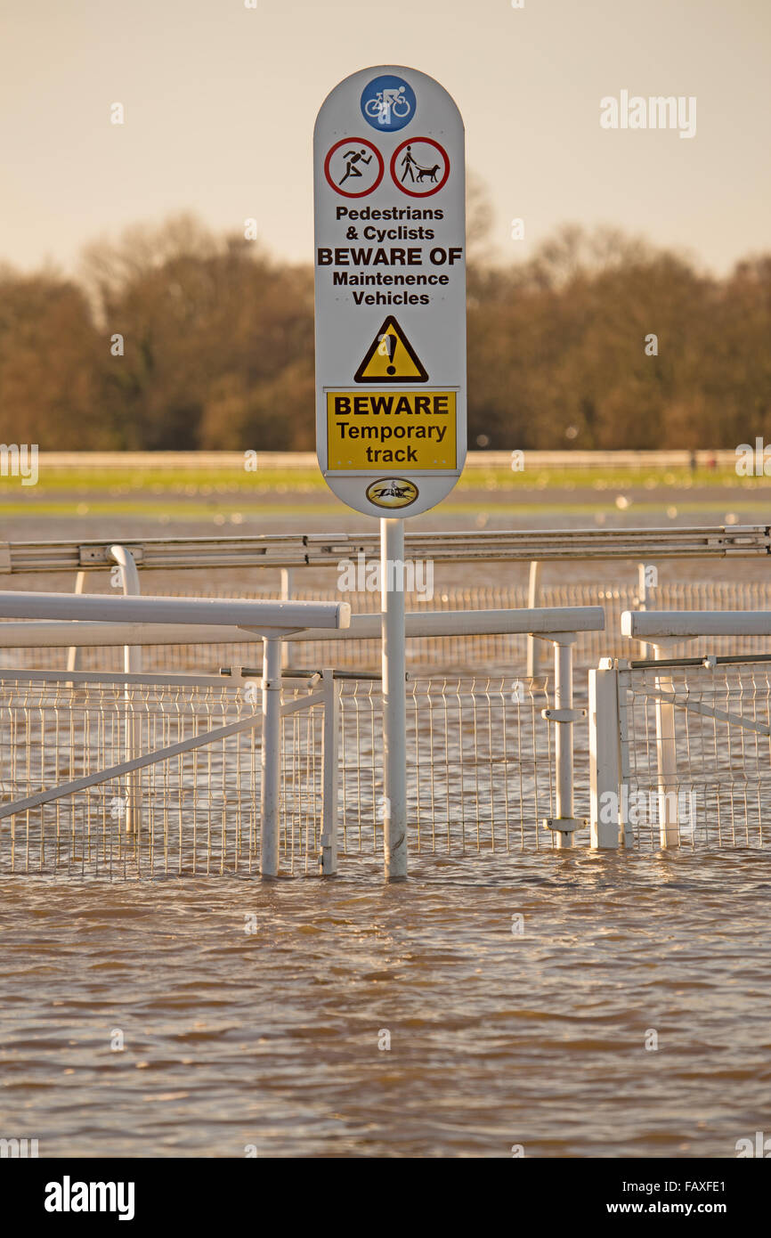 A flooded area with a sign indicating a 'temporary track' Stock Photo ...