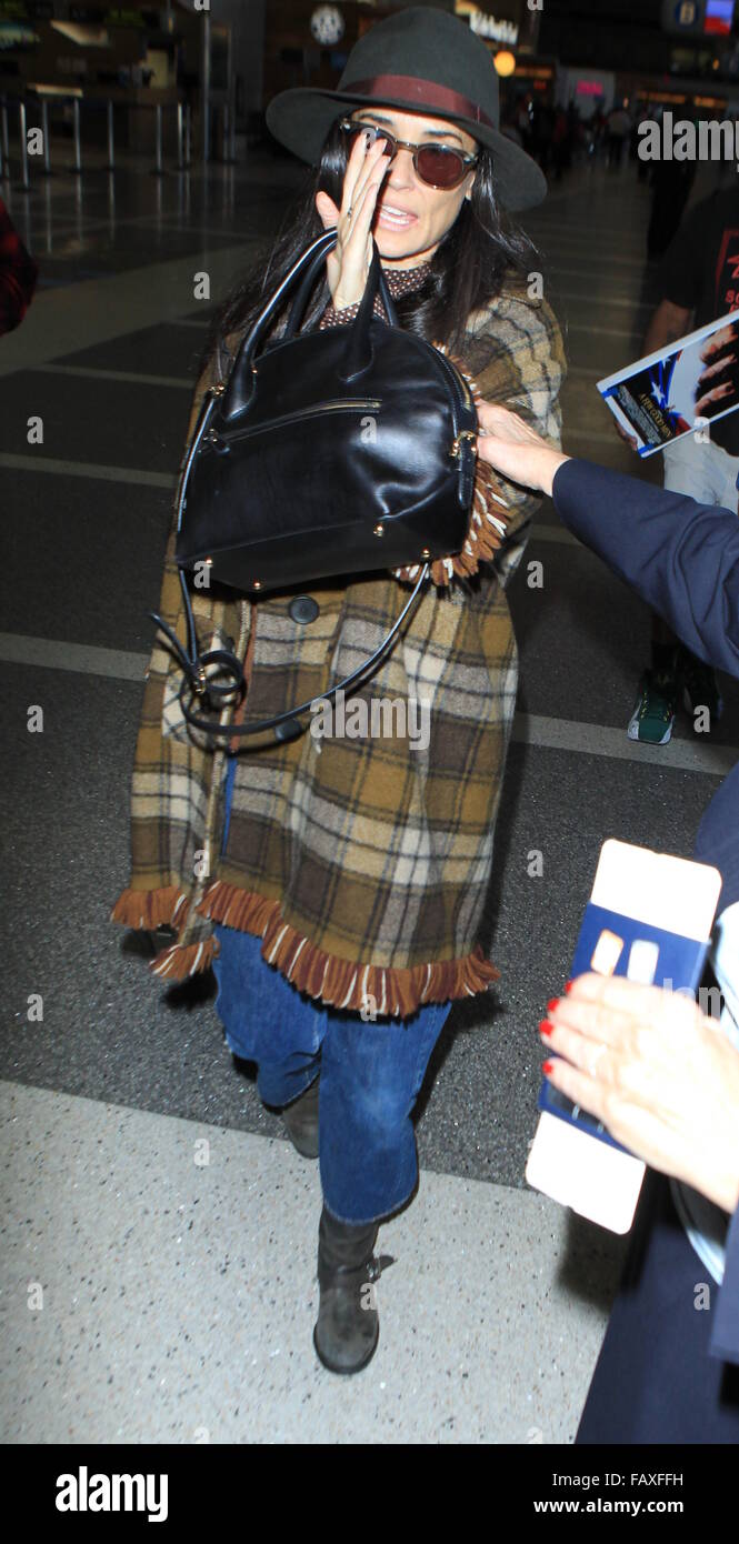 Demi Moore departs on a flight from Los Angeles International Airport ...