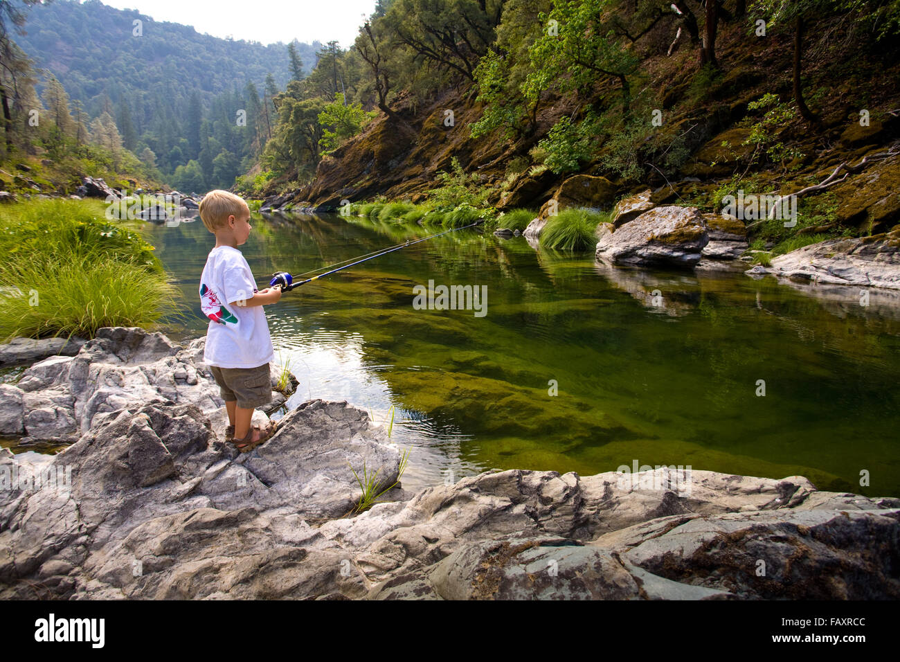 Young boy fishing on the Hayfork Creek, Trinity County, California ...
