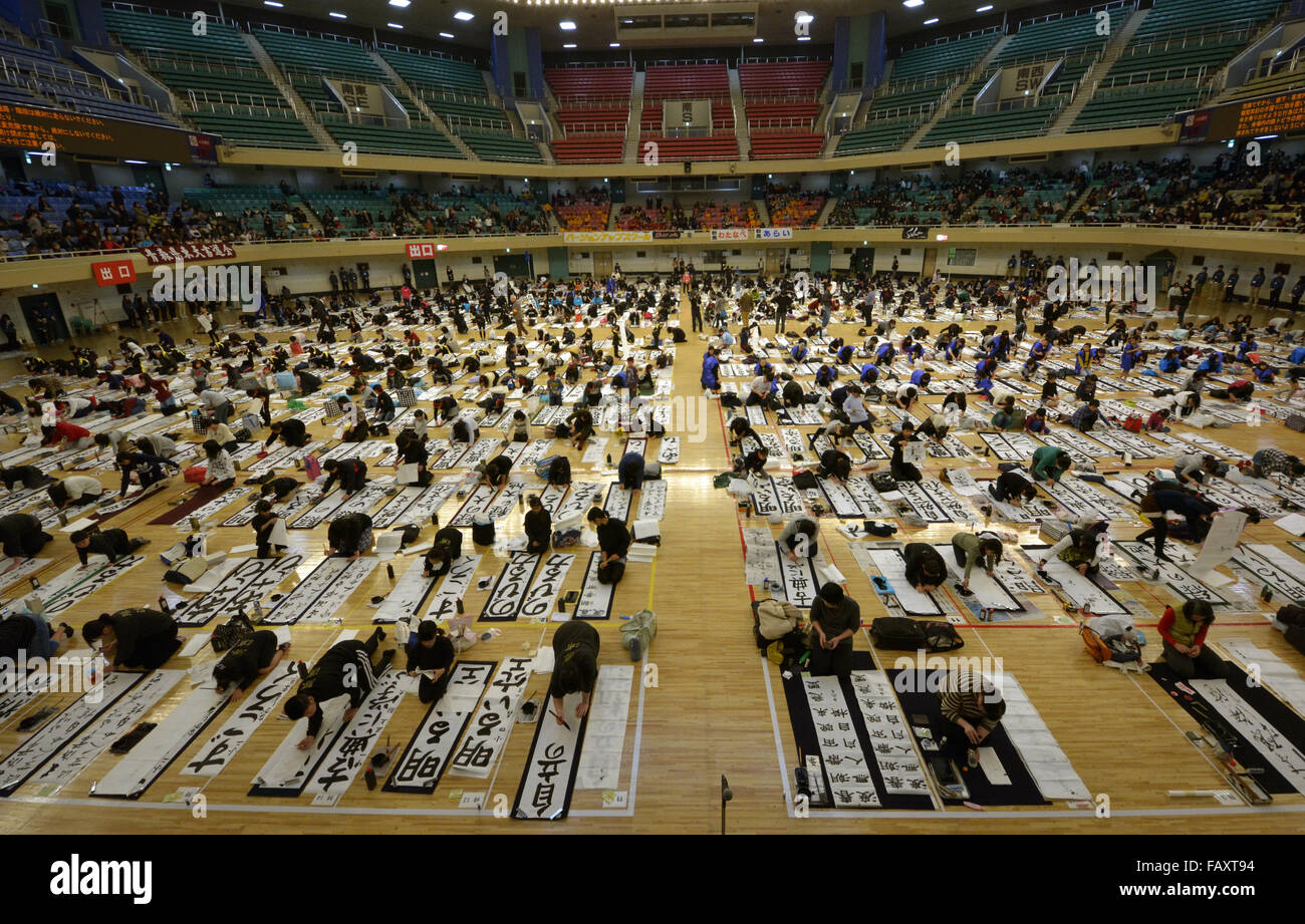 Tokyo, Japan. 5th Jan, 2016. Participants use calligraphy brushes to ...