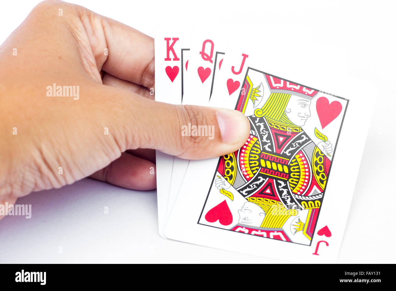 Playing cards in hand isolated on white background, stock photo Stock ...