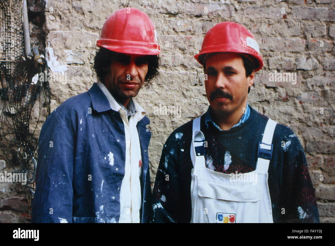 two worker with red helmets Stock Photo - Alamy