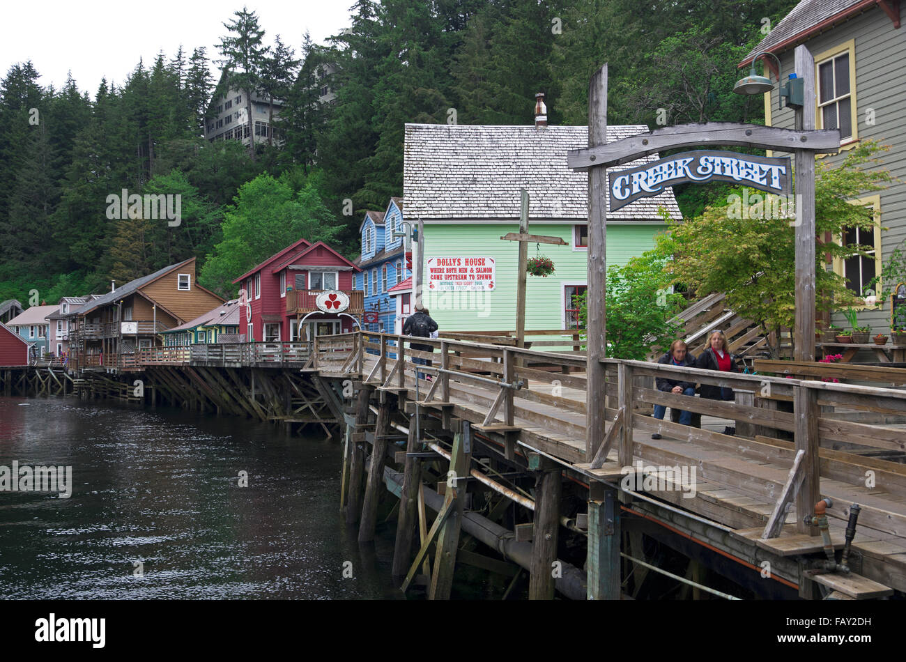 Tourists enjoy a visit to the boardwalk on Creek Street, Ketchikan ...