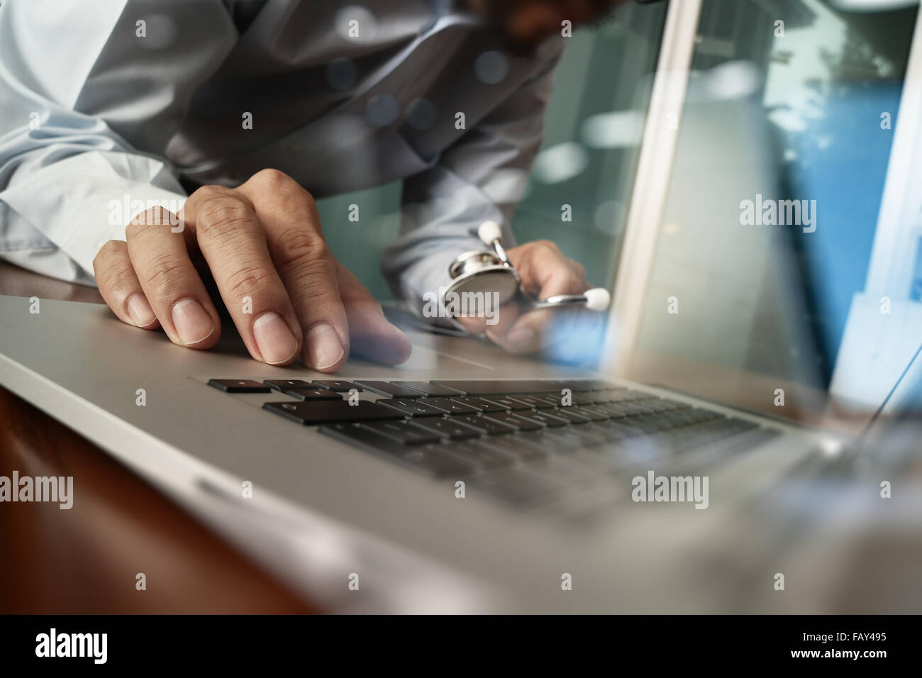 Medicine doctor hand working with modern computer and medical diagram ...