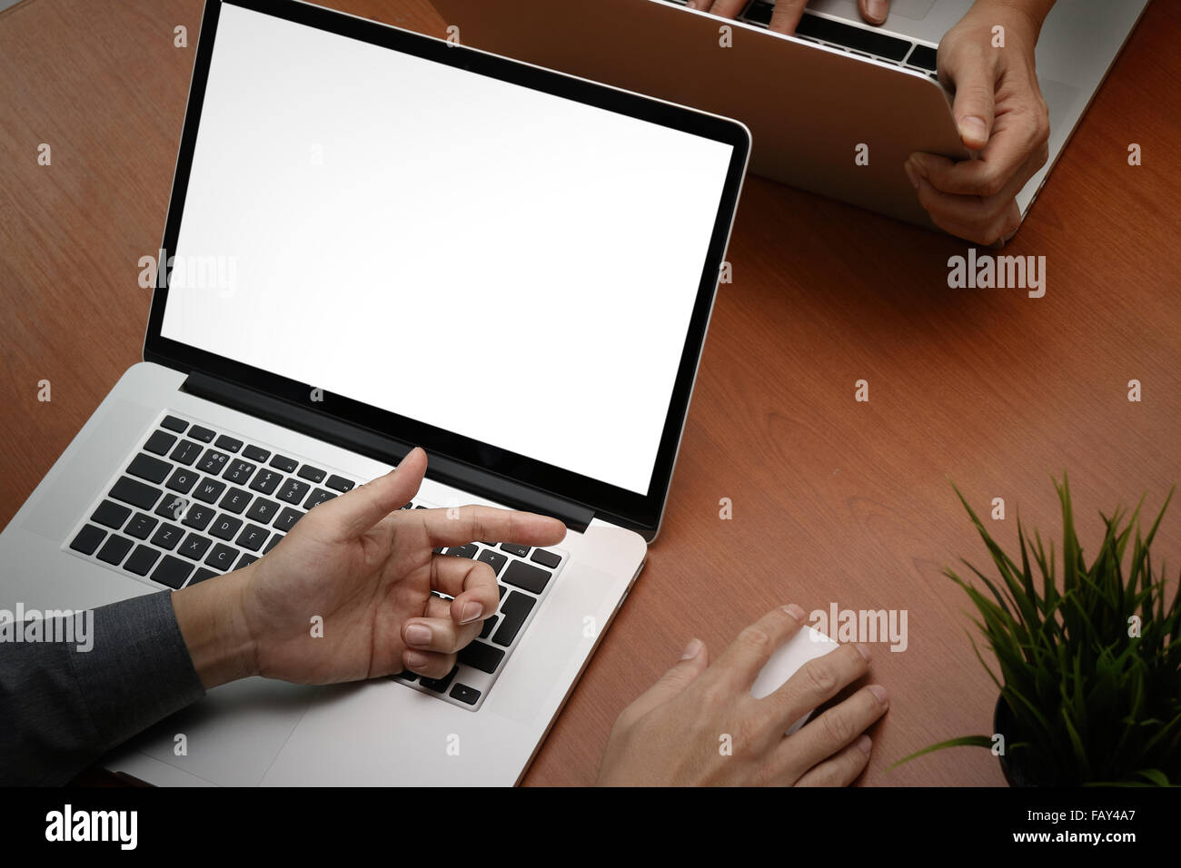 top view of two businessmen hand working with new modern computer ...