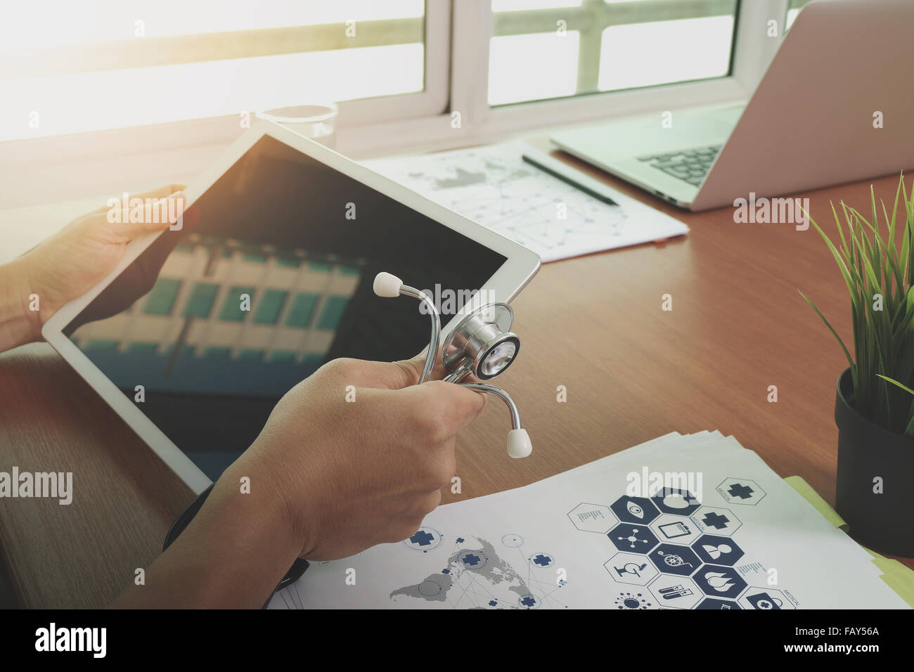 top view of Medicine doctor hand working with modern computer and ...