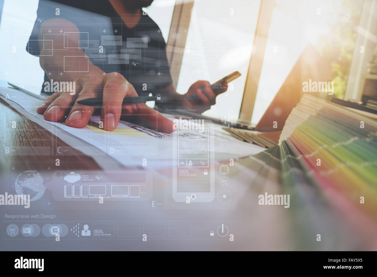 Designer hand working with laptop computer and smarth phone and digital ...