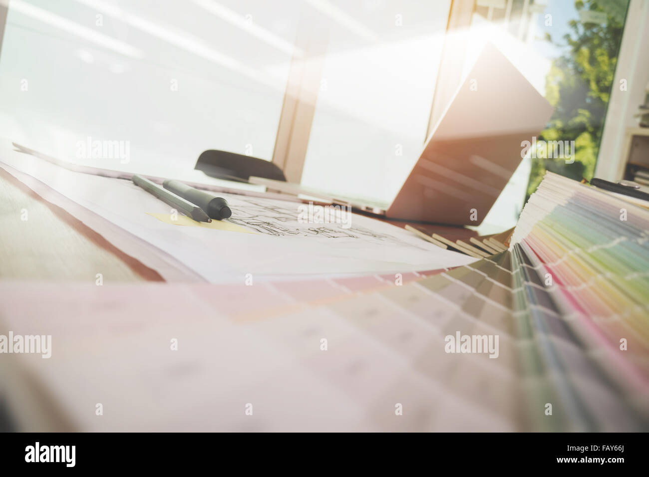 Designer workspace with laptop computer and smarth phone and digital ...