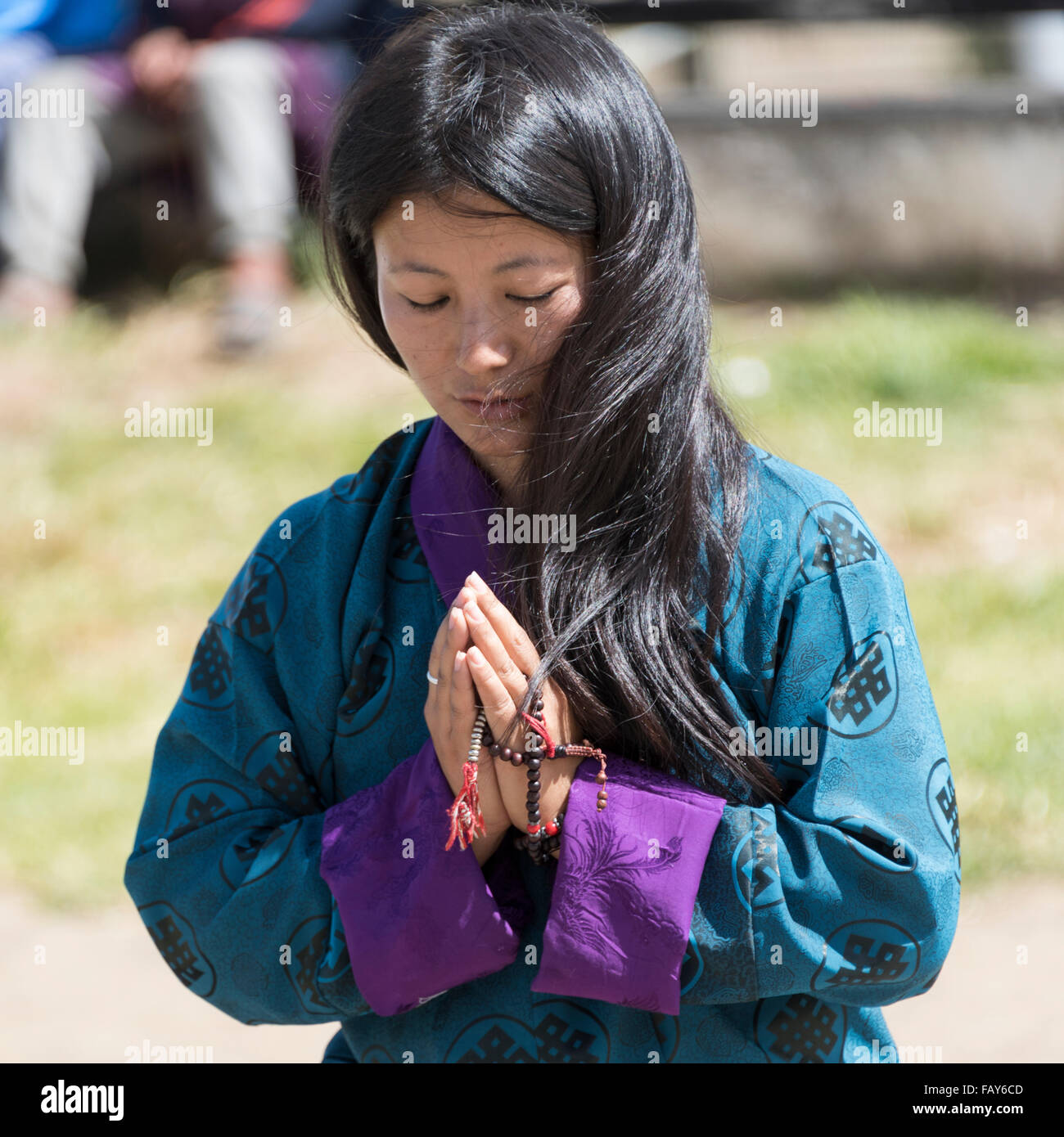 A young buddhist woman praying; Thimphu, Bhutan Stock Photo - Alamy