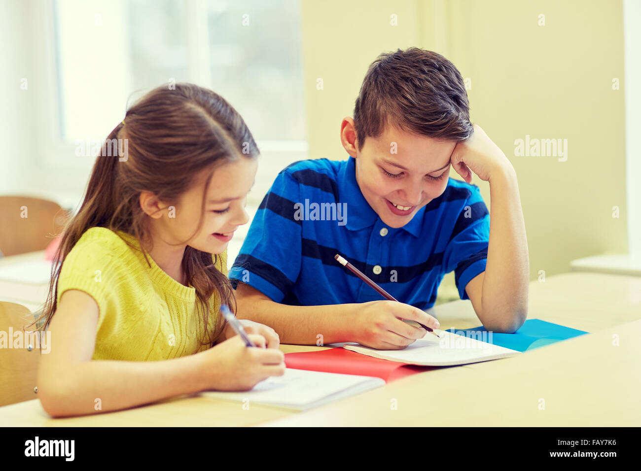group of school kids writing test in classroom Stock Photo - Alamy