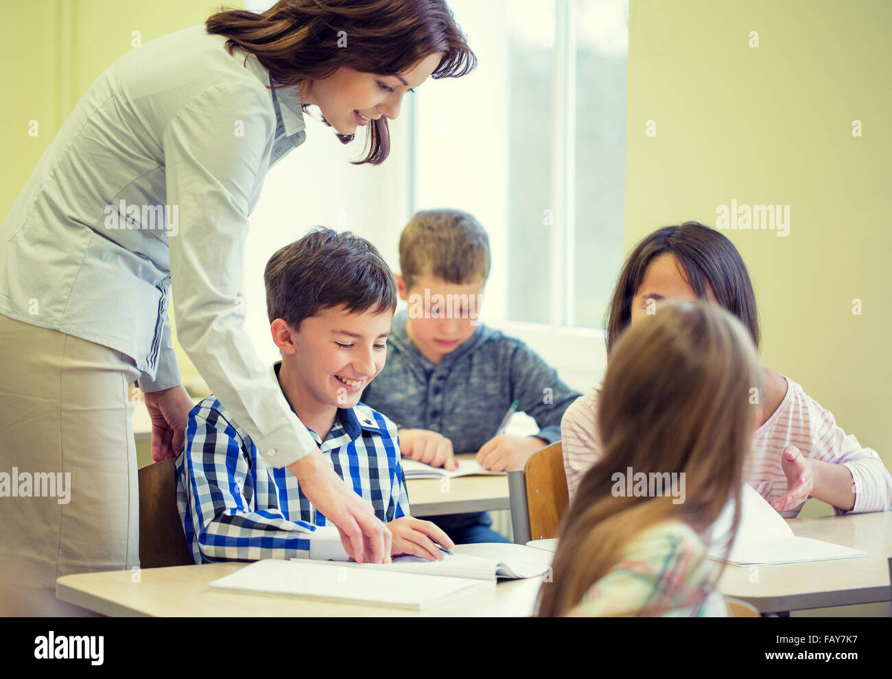 group of school kids writing test in classroom Stock Photo - Alamy