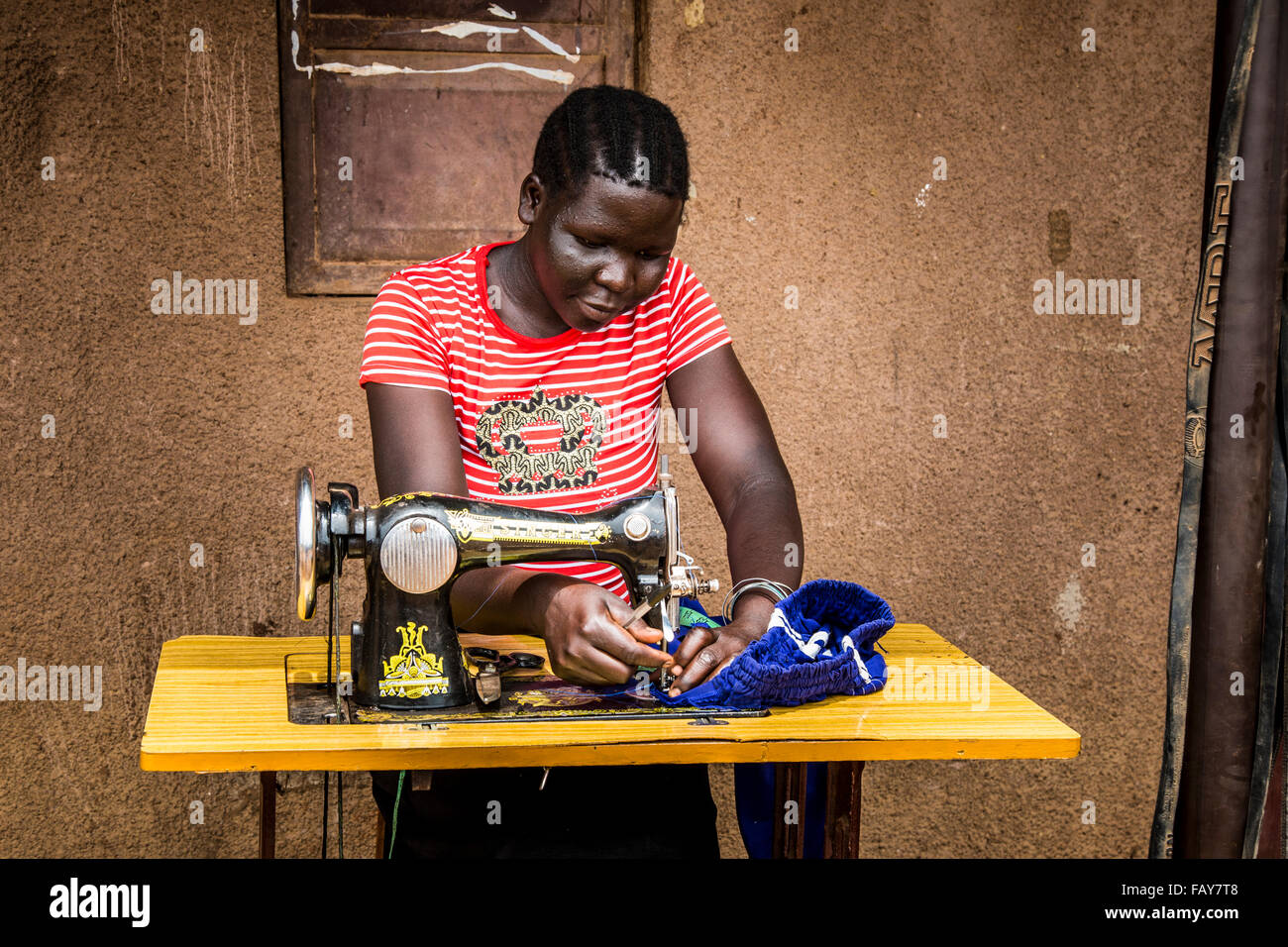 African Seamstress Standing High Resolution Stock Photography and ...