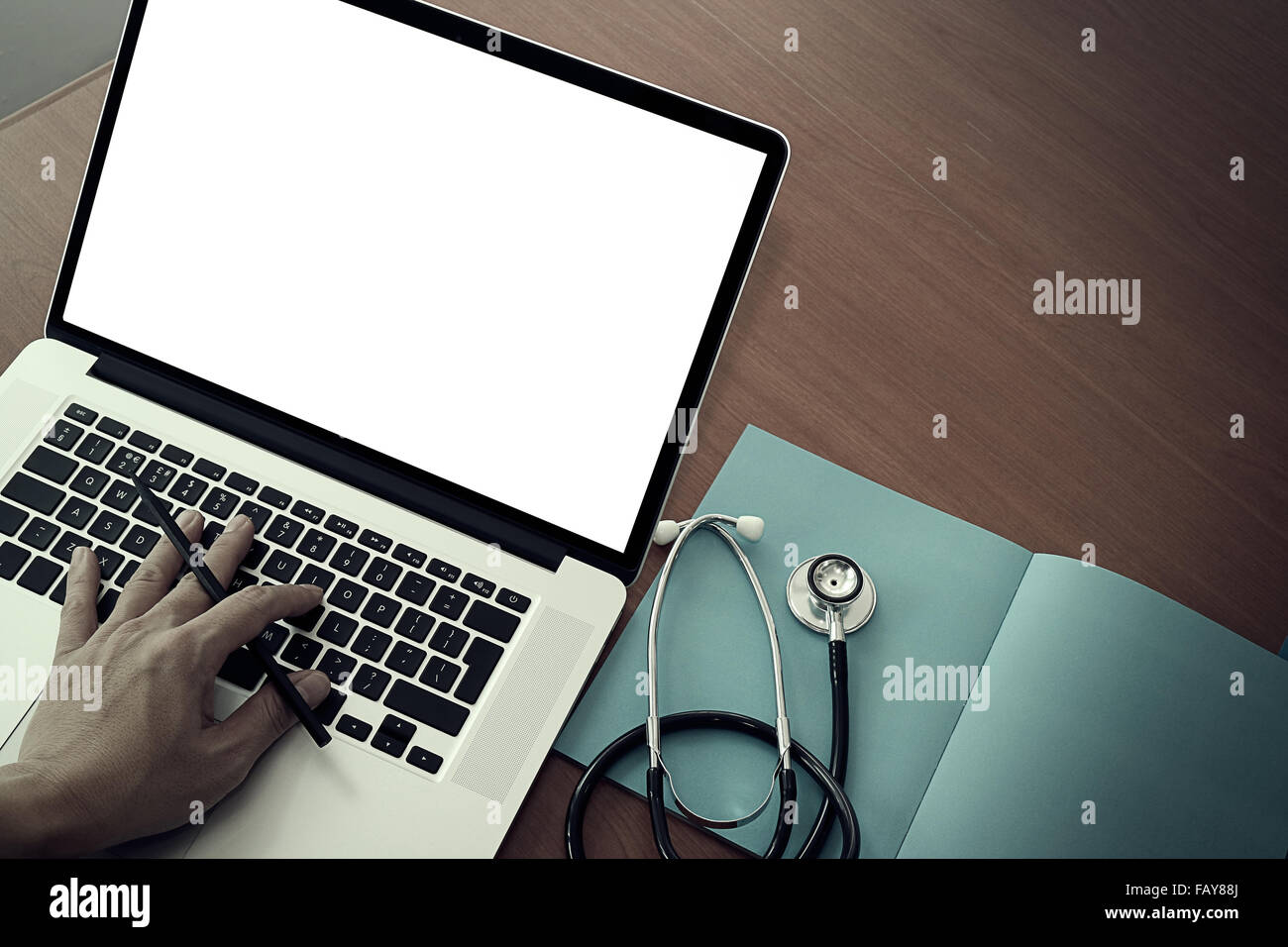top view of Medicine doctor hand working with modern computer and blank ...