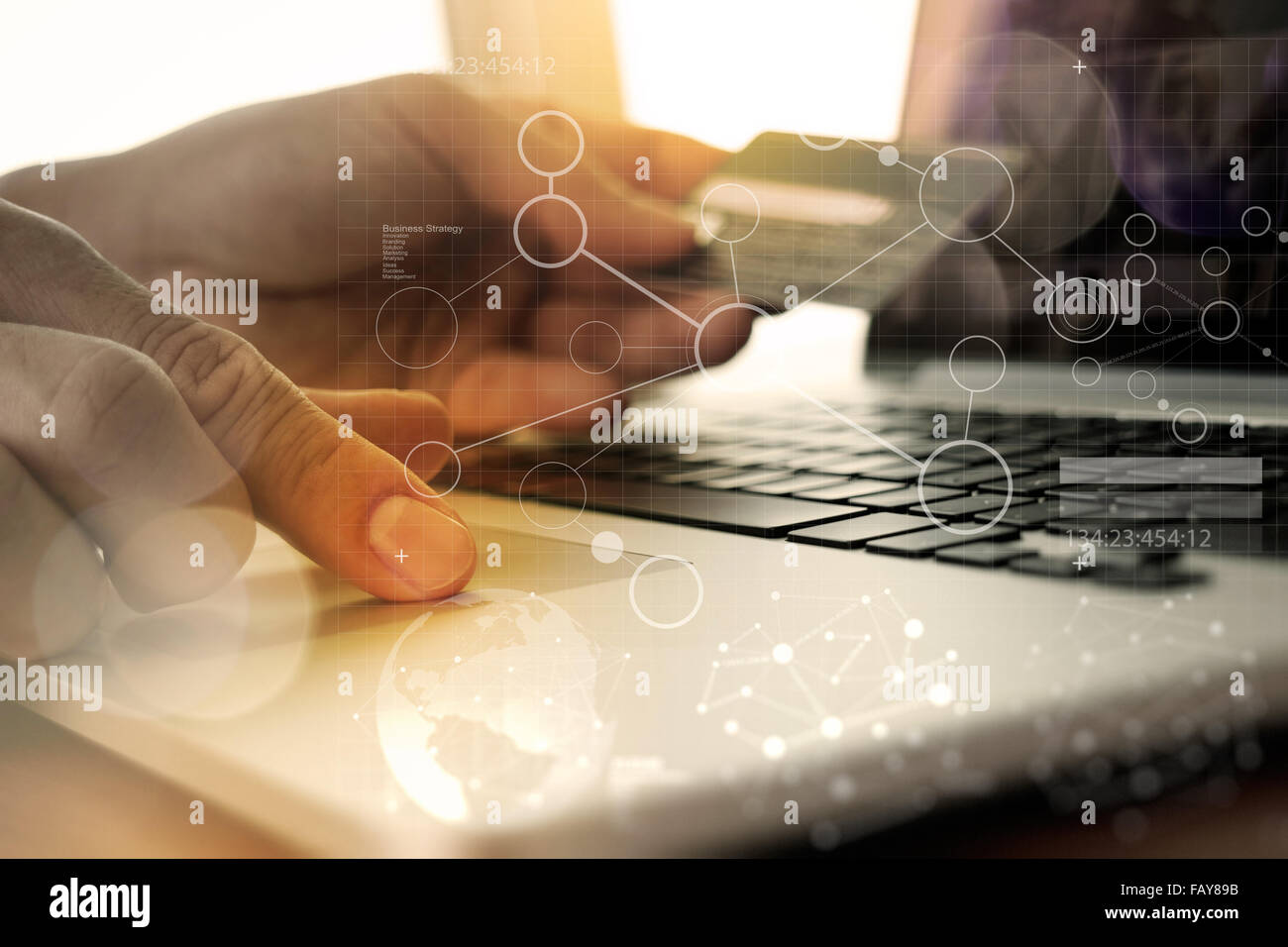 hands using laptop and holding credit card with digital layer effect ...