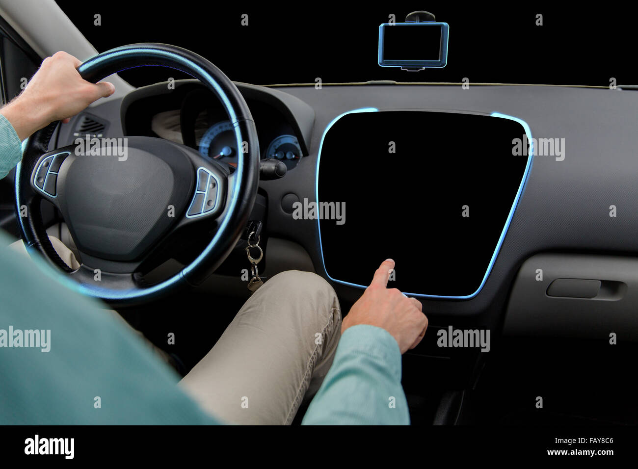 close up of man driving car with on board computer Stock Photo - Alamy