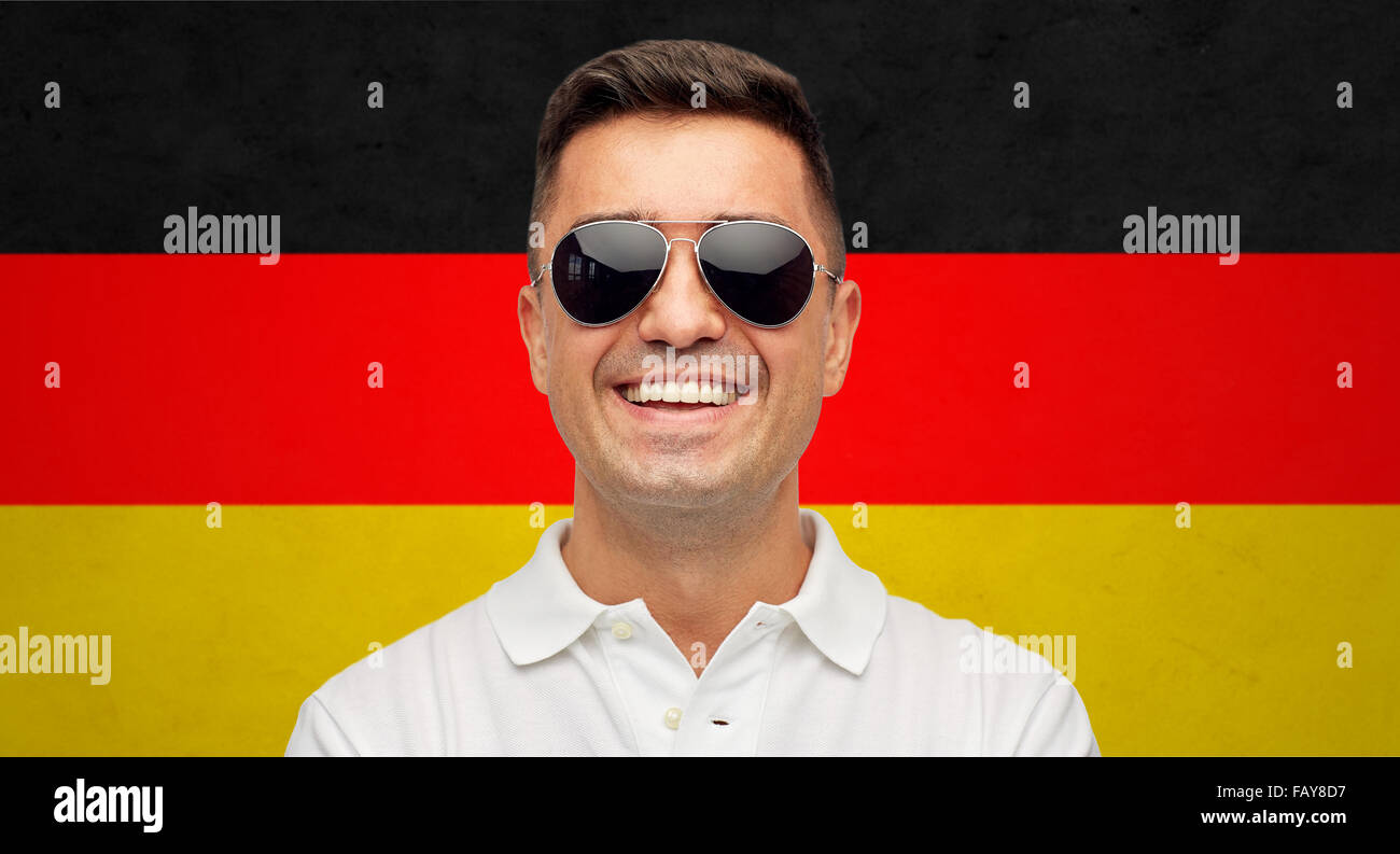 face of smiling man in sunglasses over german flag Stock Photo - Alamy