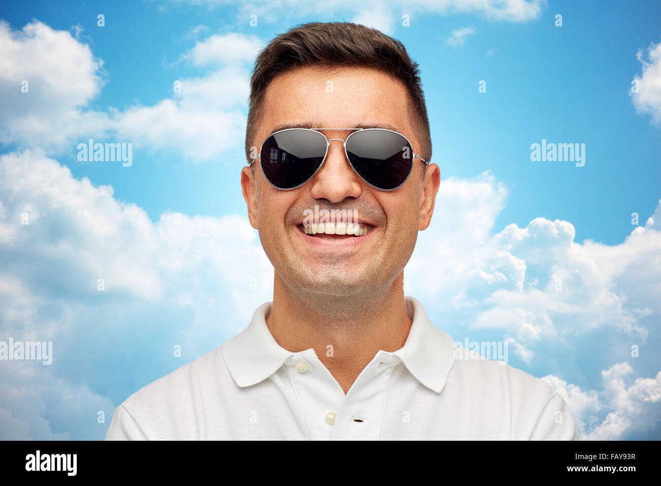 Smiling face over blue hi-res stock photography and images - Alamy