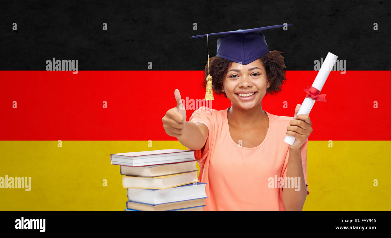 happy bachelor girl with diploma showing thumbs up Stock Photo - Alamy