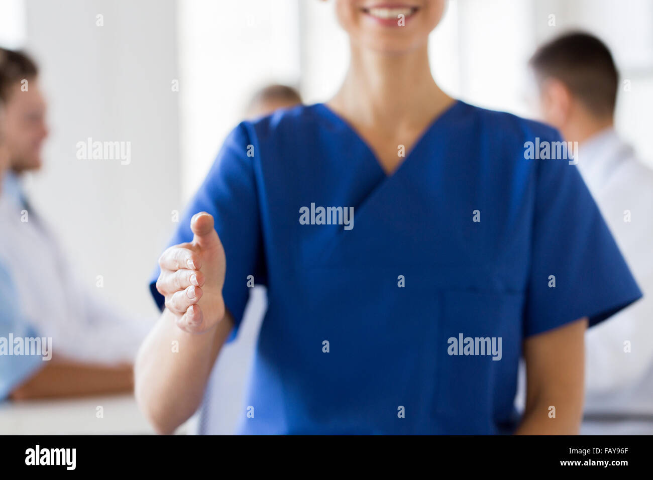 Happy doctor handshake nurse hi-res stock photography and images - Alamy