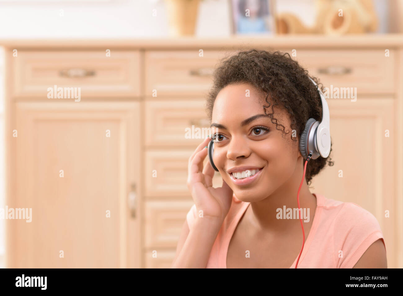 Positive girl listening to music Stock Photo - Alamy