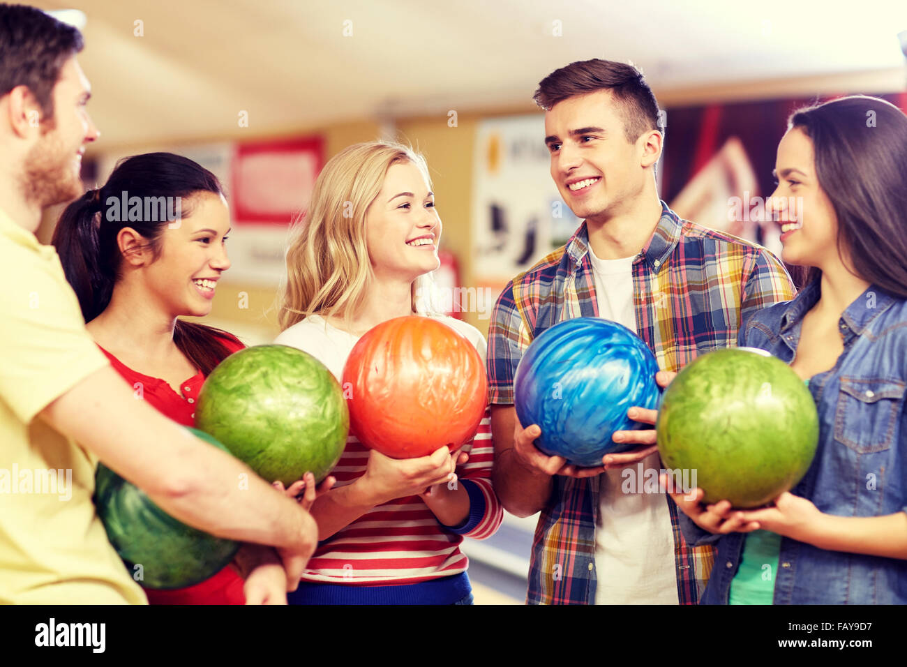 happy friends in bowling club Stock Photo - Alamy