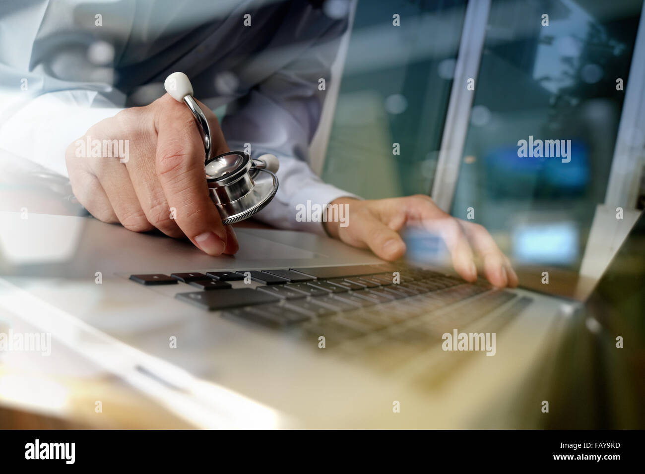 doctor working with laptop computer in medical workspace office and ...