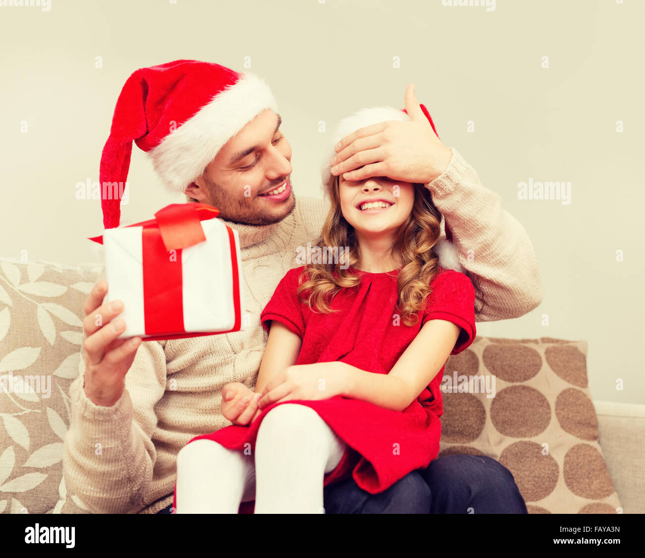 smiling father surprises daughter with gift box Stock Photo - Alamy