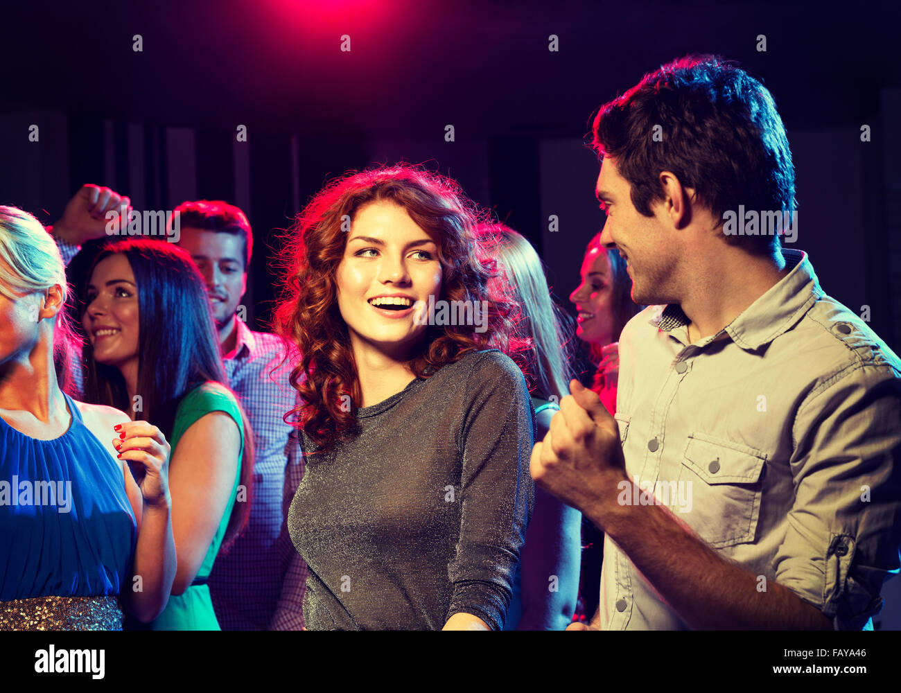 smiling friends dancing in club Stock Photo - Alamy