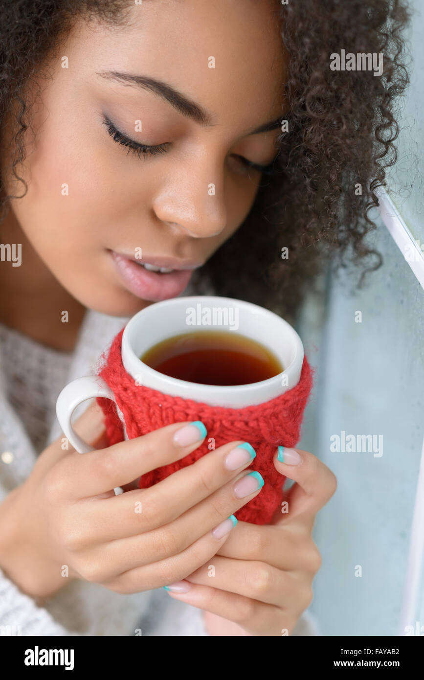 Happy girl drinking tea Stock Photo - Alamy