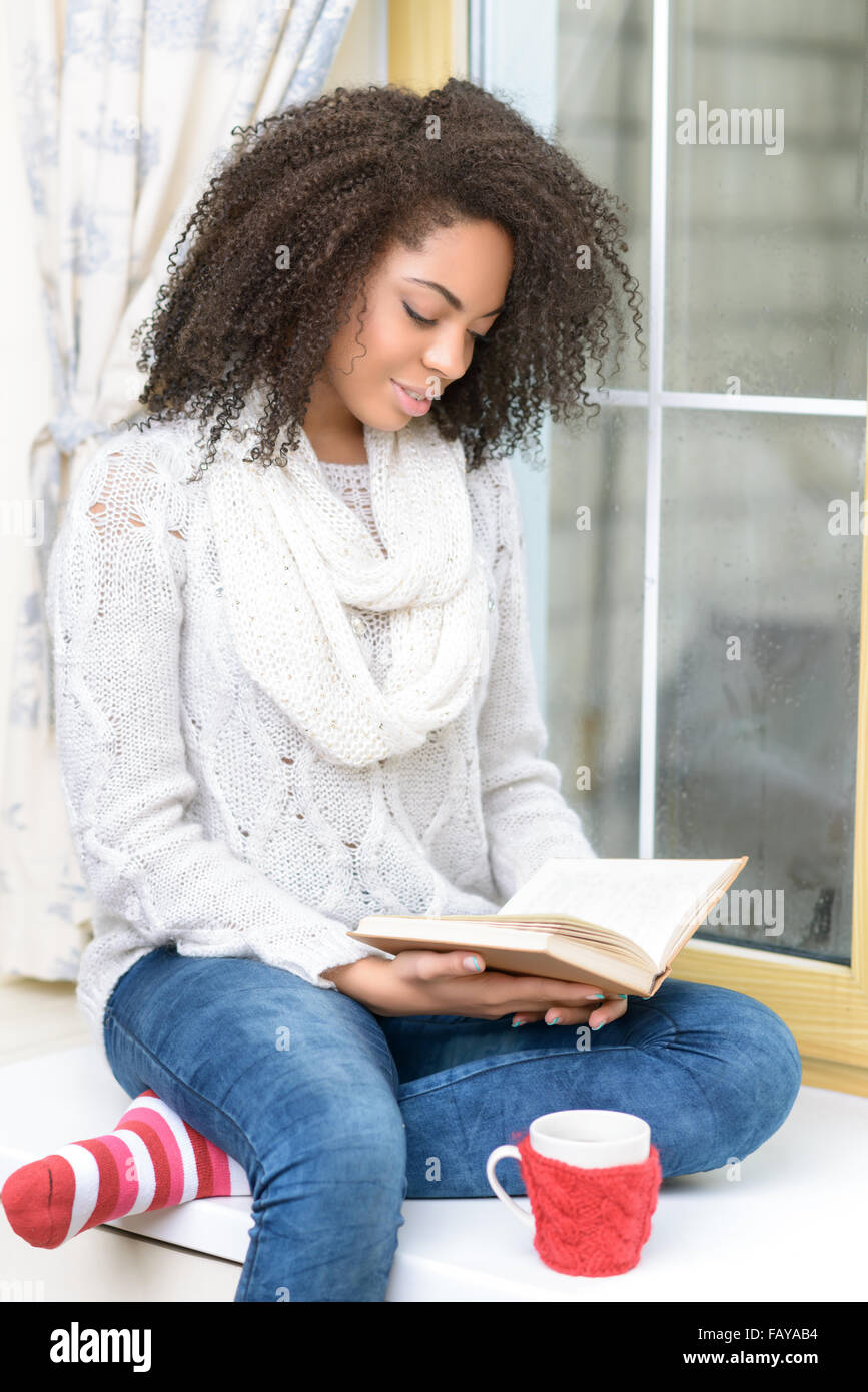 Happy girl drinking tea Stock Photo - Alamy