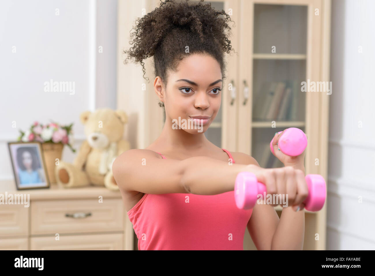 Cheerful girl doing physical exercises Stock Photo - Alamy
