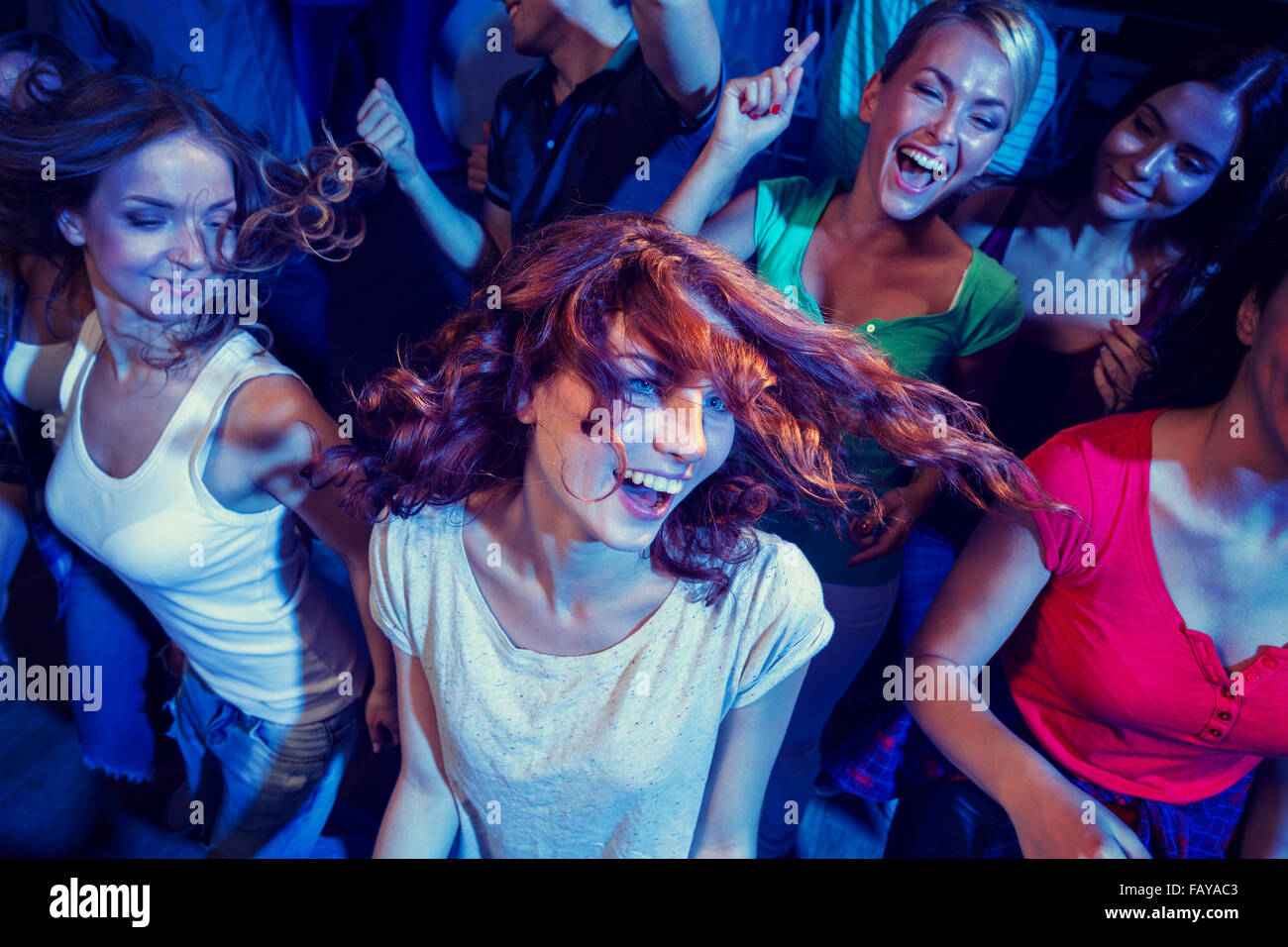 smiling friends dancing in club Stock Photo - Alamy
