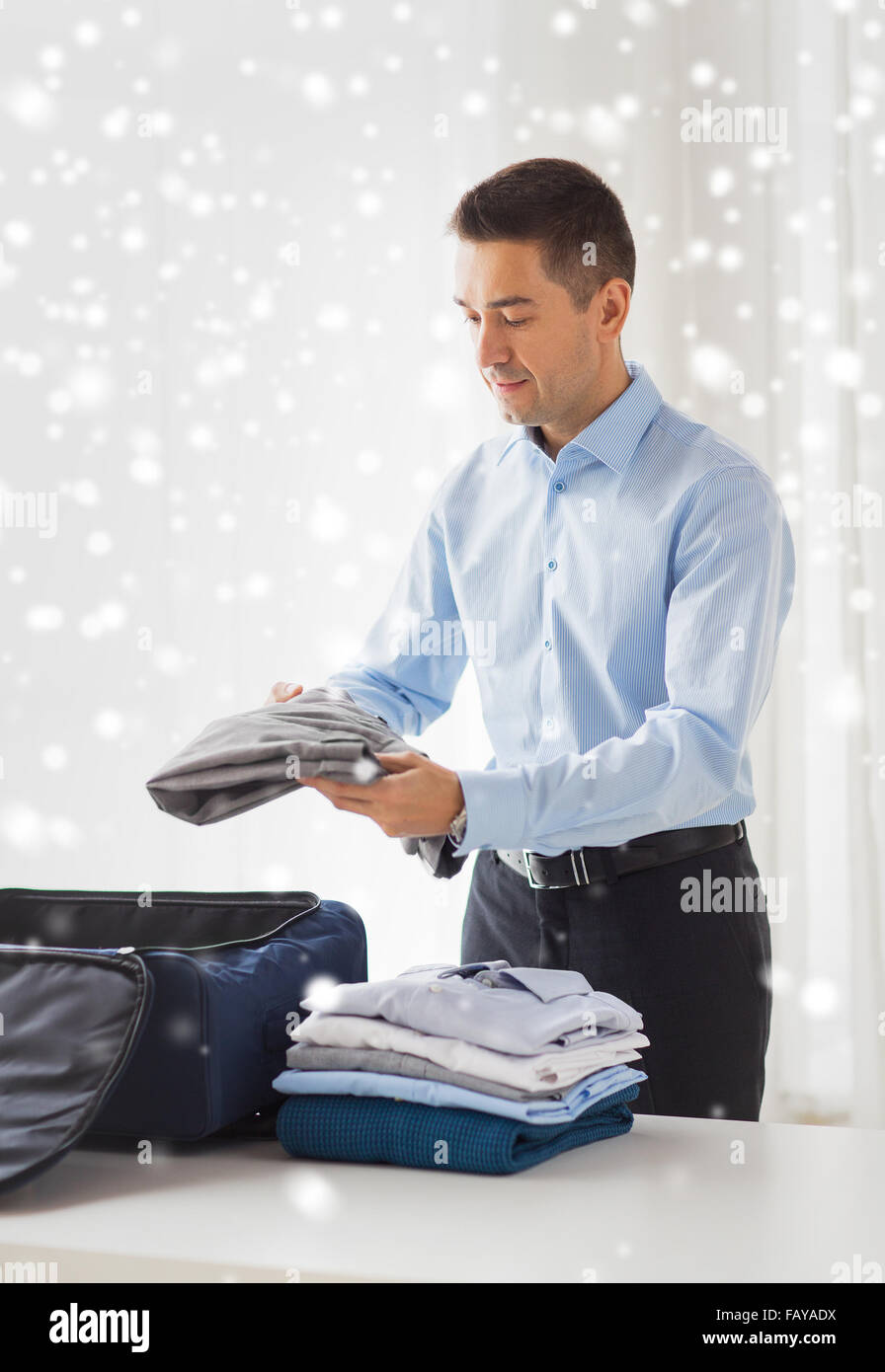 businessman packing clothes into travel bag Stock Photo - Alamy