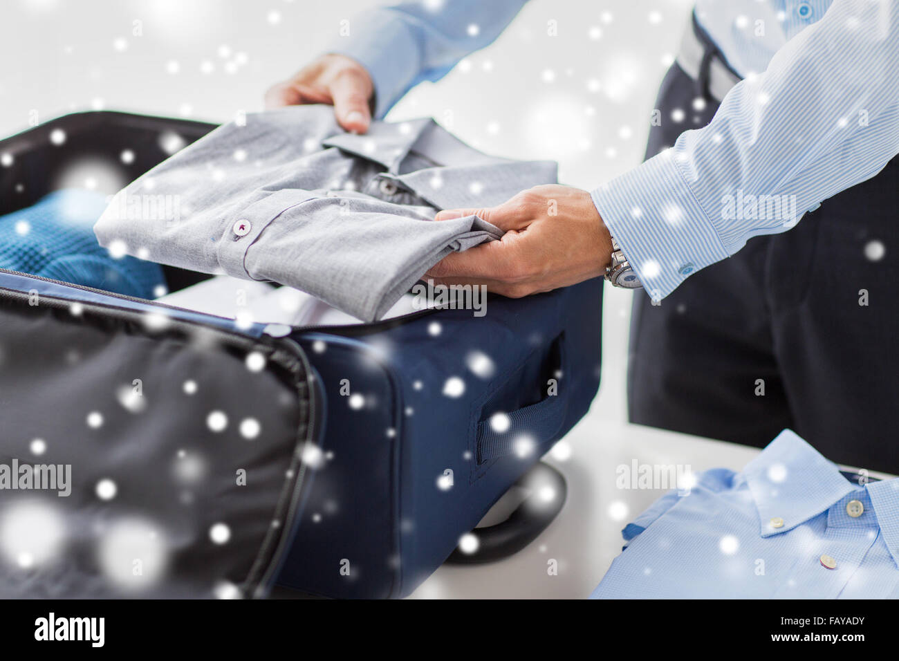 businessman packing clothes into travel bag Stock Photo - Alamy