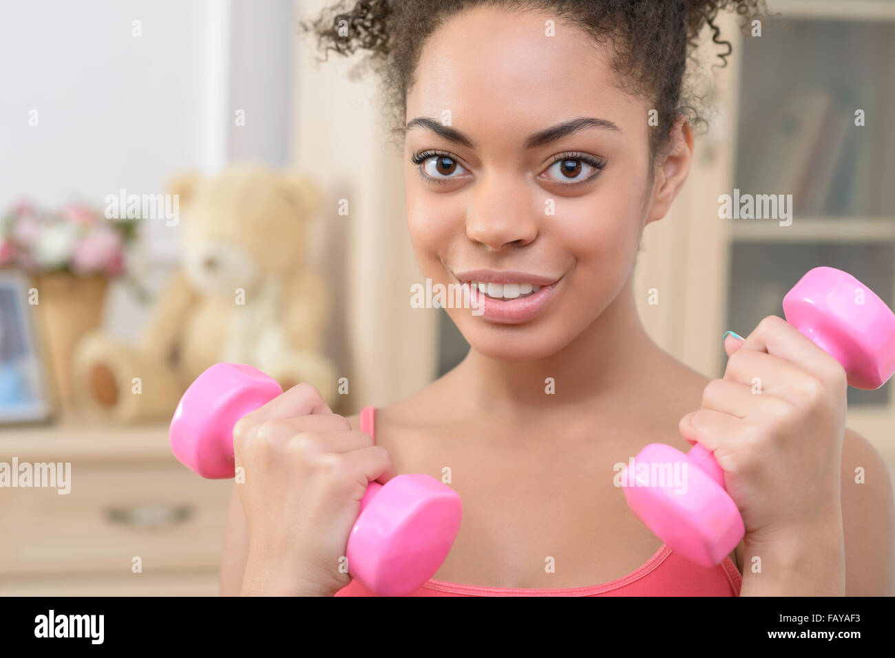Cheerful girl doing physical exercises Stock Photo - Alamy Cheerful girl doing physical exercises Stock Photo - Alamy